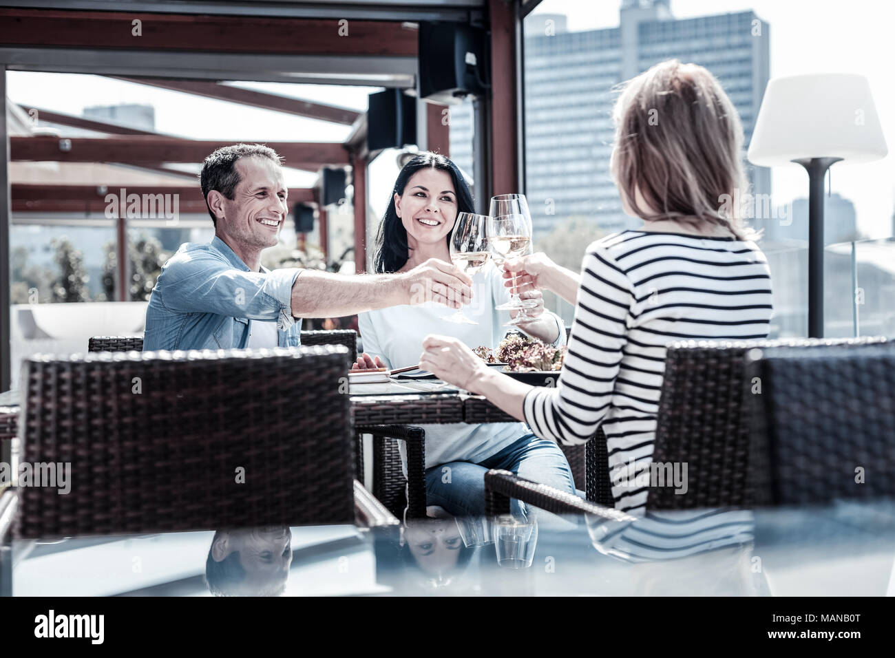 Positive delighted people cheering with wine Stock Photo - Alamy