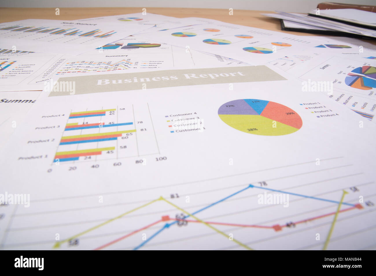 Business report. Graphs and charts. Business reports and pile of ...