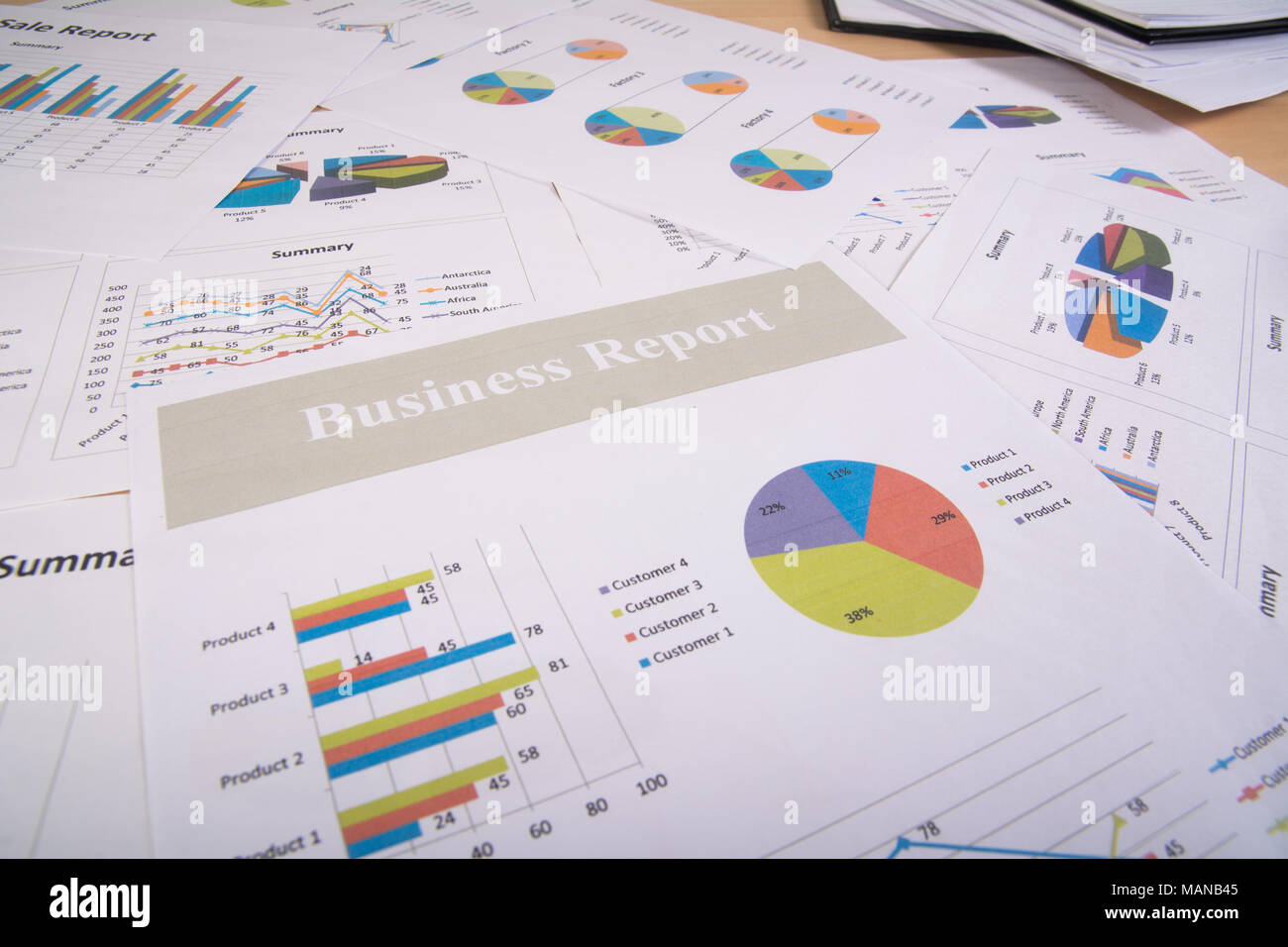 Business report. Graphs and charts. Business reports and pile of ...