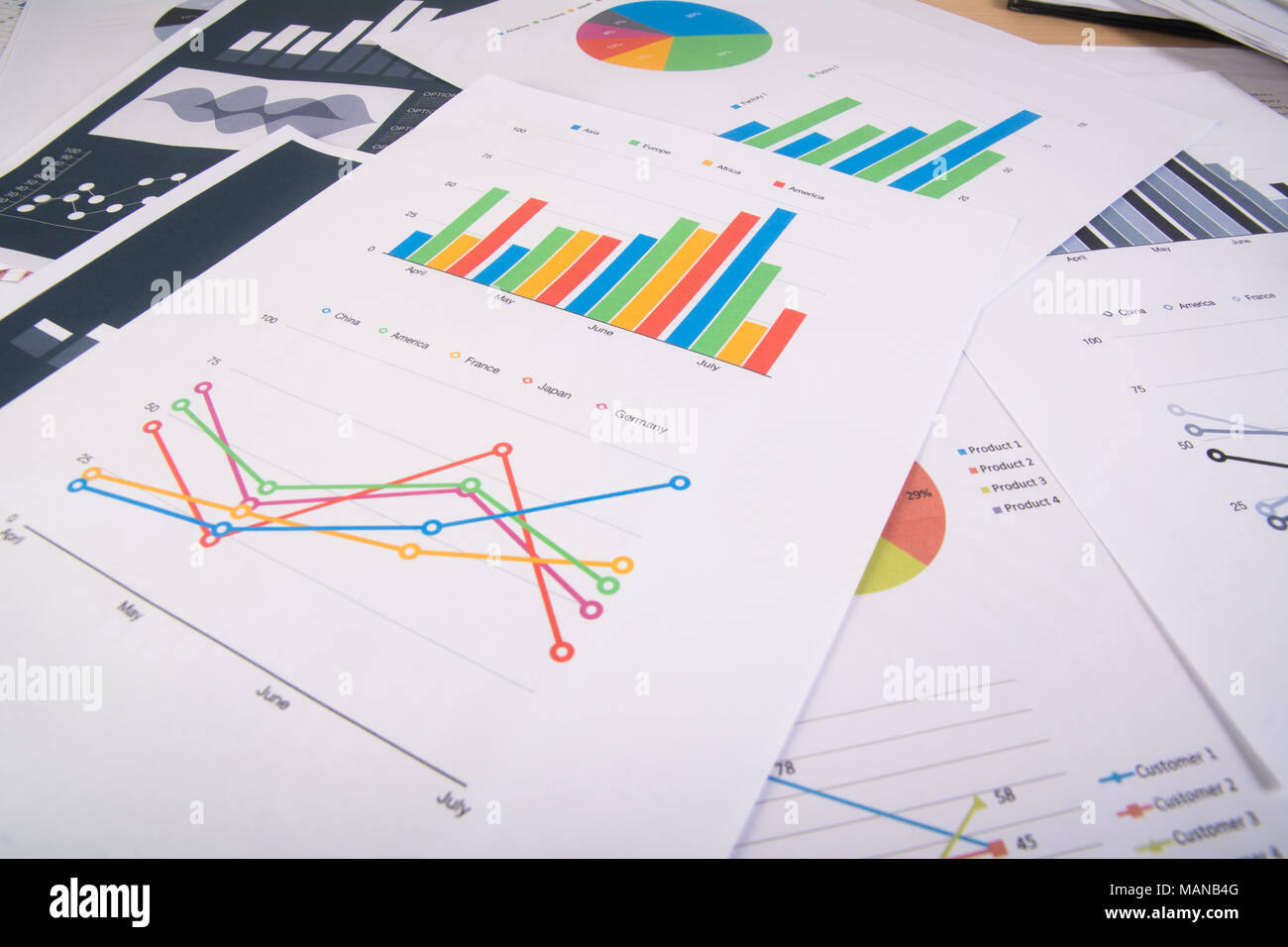 Business report. Graphs and charts. Business reports and pile of ...