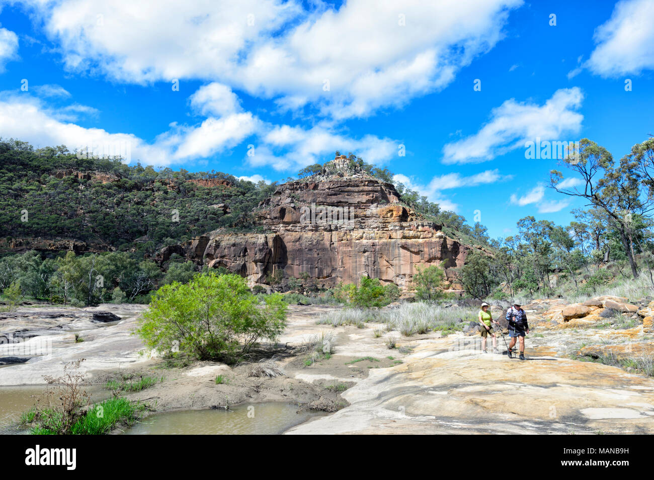 A couple of hikers at Porcupine Gorge National Park, in front of The ...