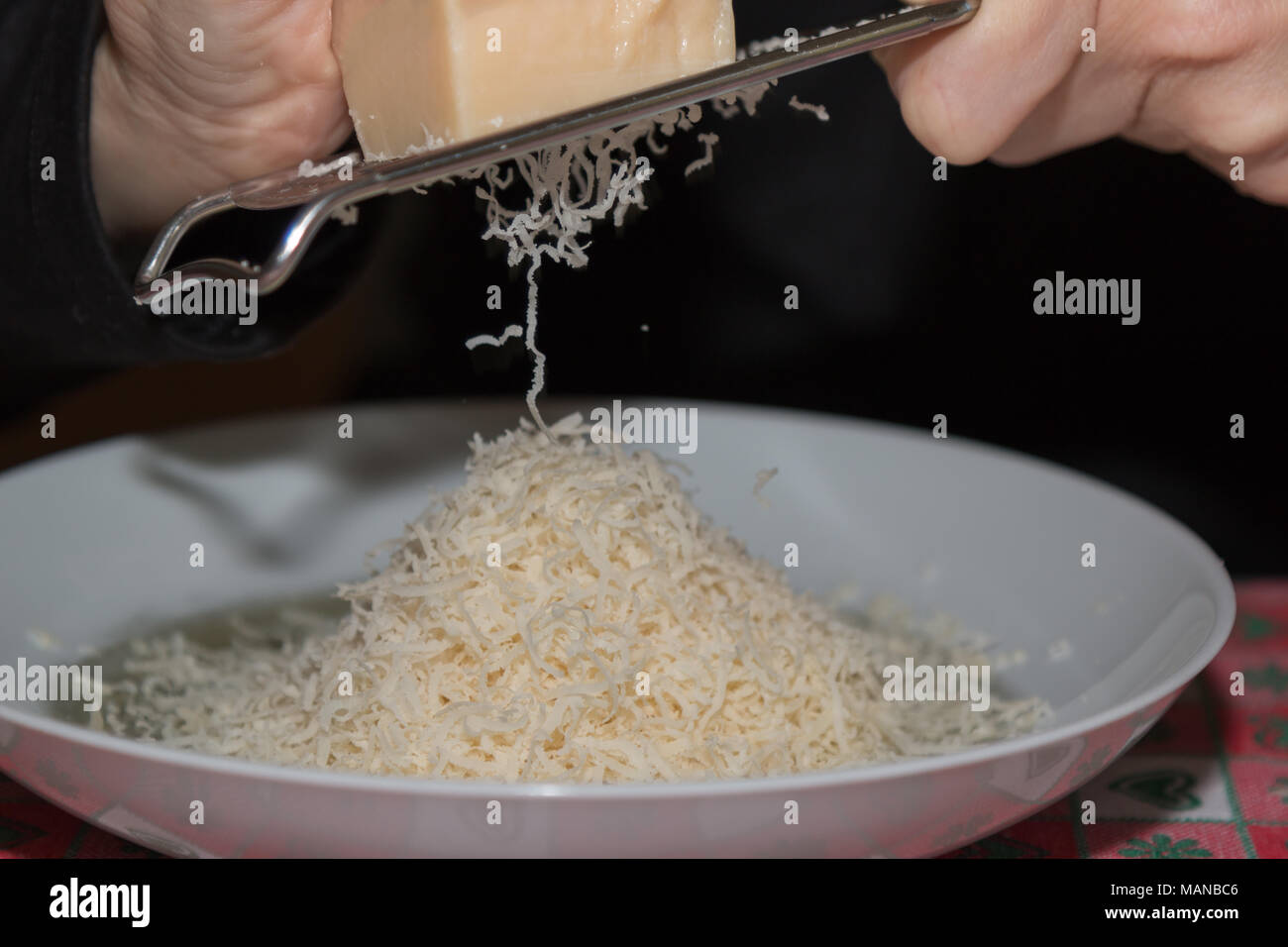 Manual Metallic Silver Grater: Grating Fresh Cheese Stock Photo - Alamy