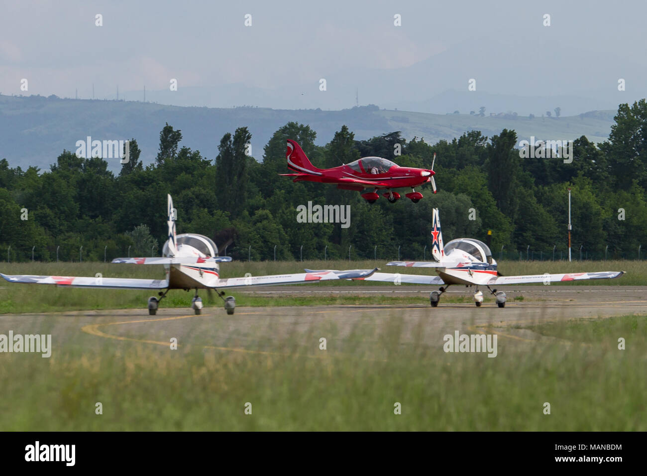 Small and Light Red Piper Aircraft Taking off from the Runway Stock ...