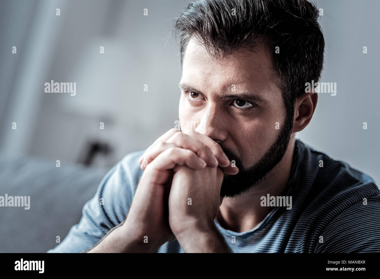 Depressed unhappy man thinking Stock Photo - Alamy