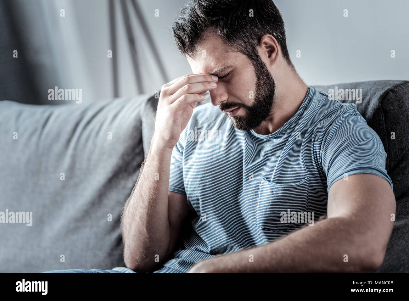 Sad unhappy man feeling tired Stock Photo - Alamy