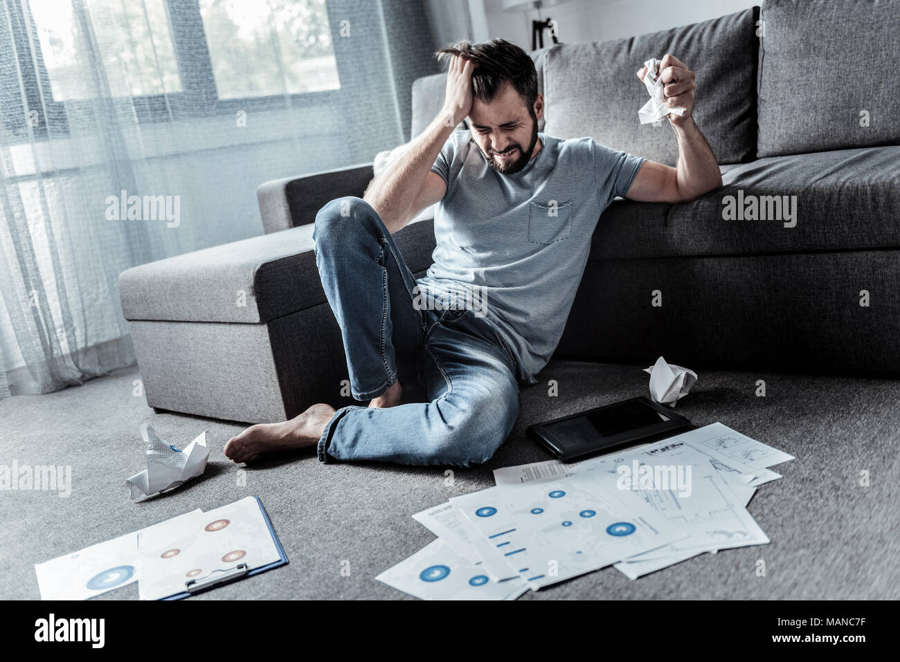 Depressed angry man not coping with his work Stock Photo - Alamy