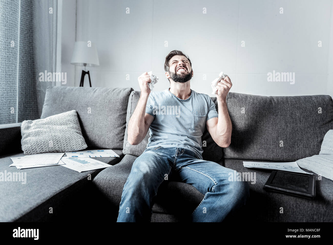 Cheerless stressed out man having nervous breakdown Stock Photo - Alamy