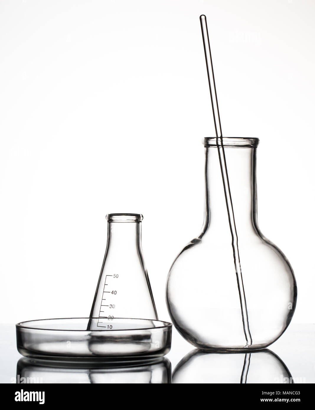 Laboratory glassware on white background Stock Photo - Alamy