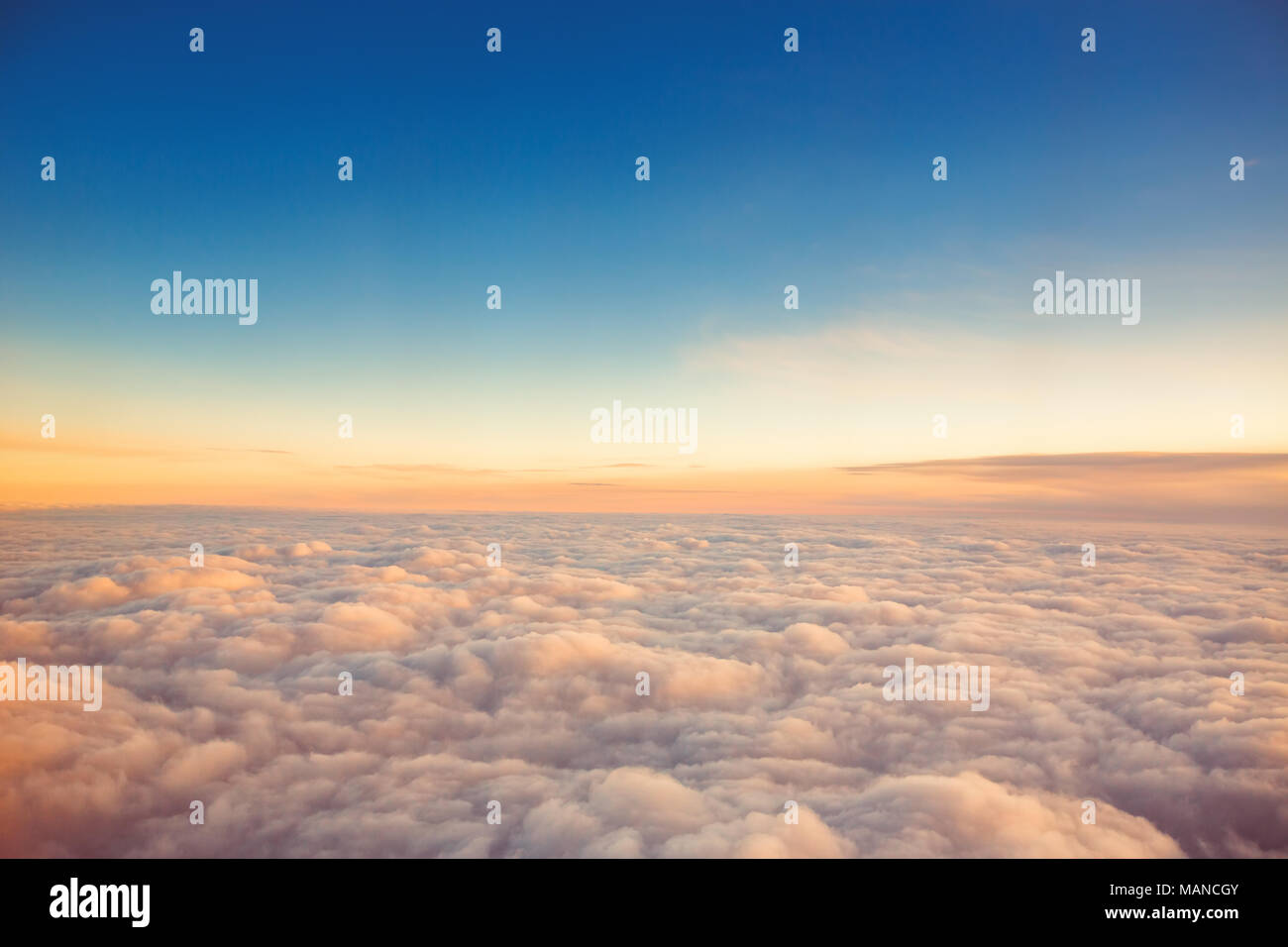 Flying above the clouds. view from the airplane Stock Photo - Alamy