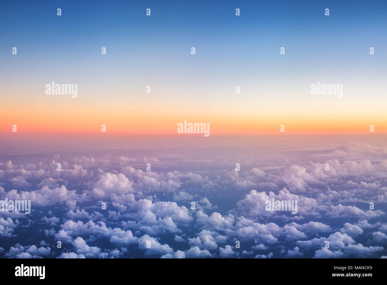 Travel over the clouds. Sunrise in the air. Blue sky with clouds as ...