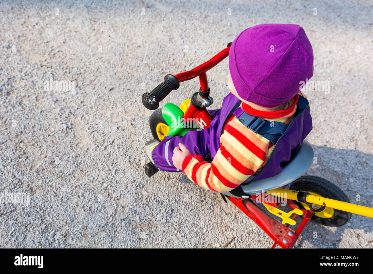 Baby riding tricycle hi-res stock photography and images - Alamy