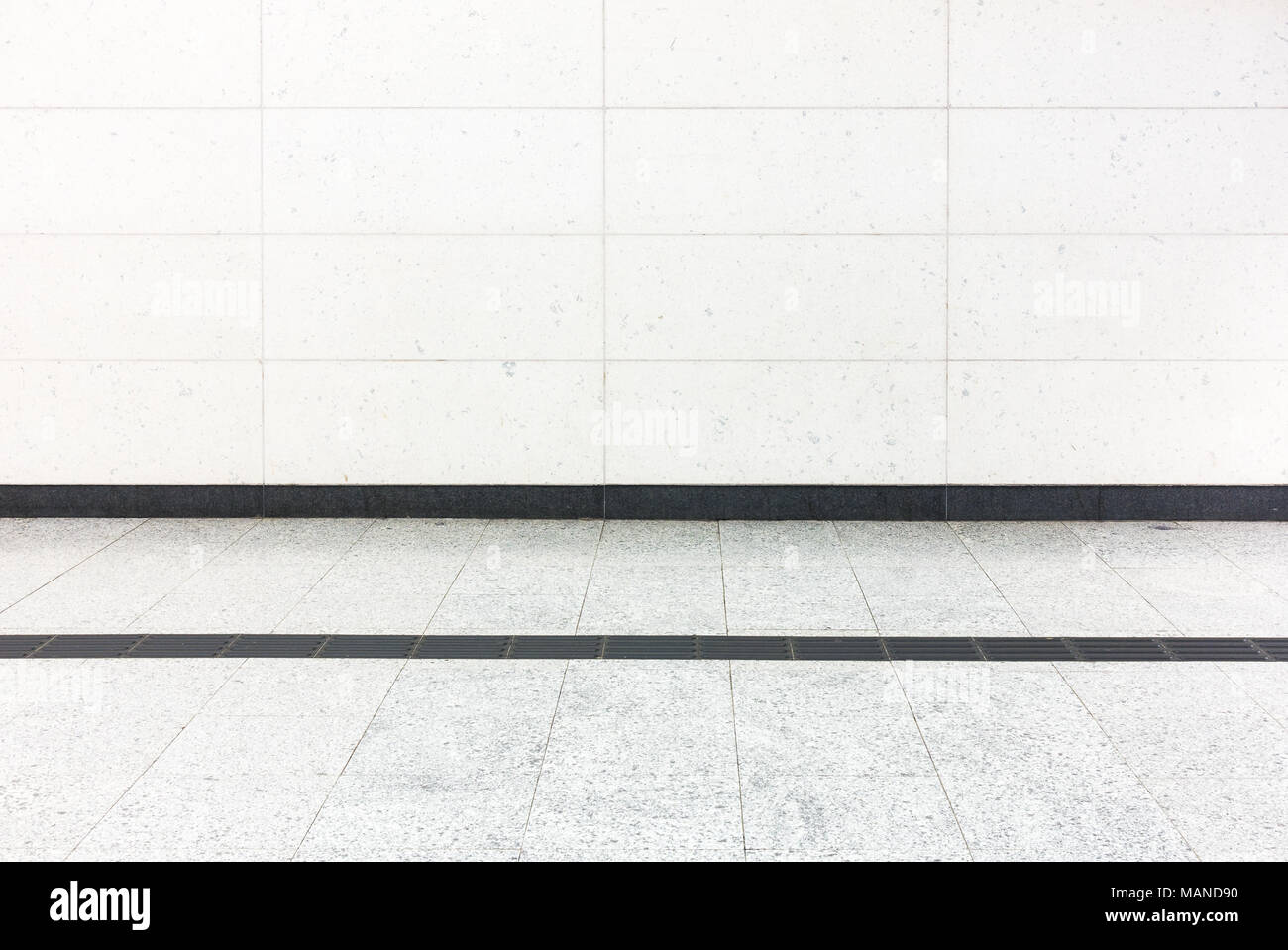 Perspective flooring tile and block wall background Stock Photo - Alamy