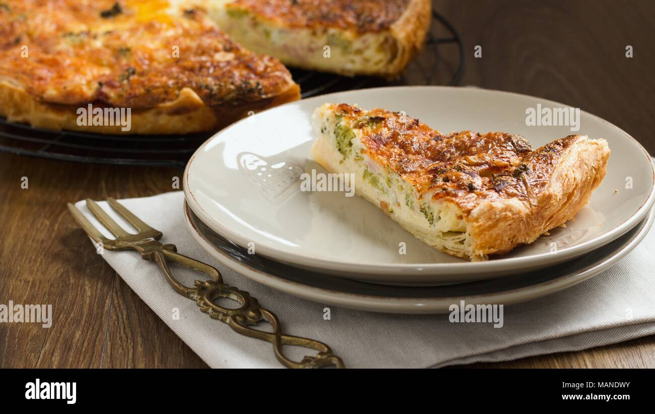 Serving of quiche, french savory pie. Wide screen aspect ratio Stock ...
