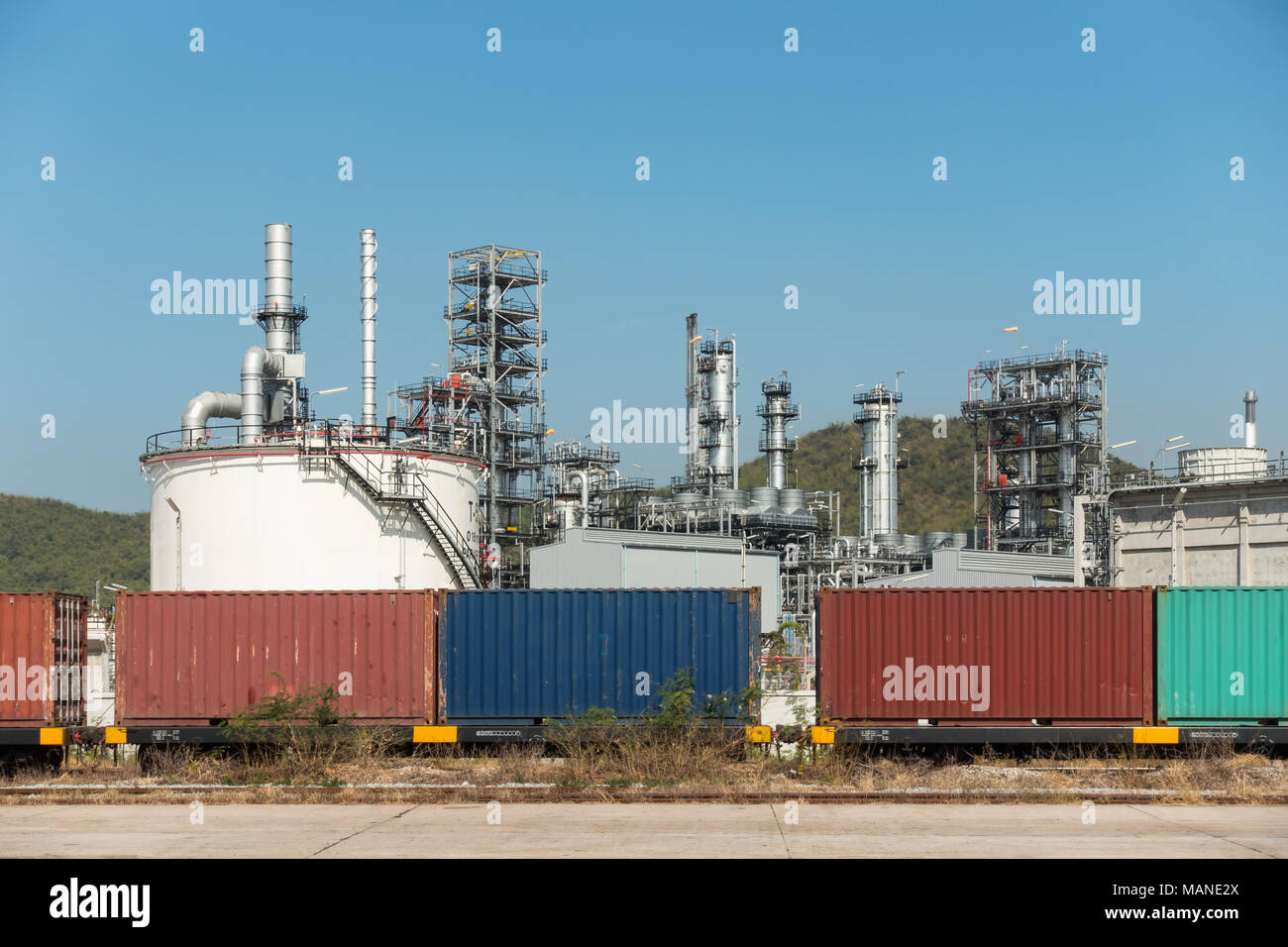 oil refinery and container shipping on daylight Stock Photo - Alamy