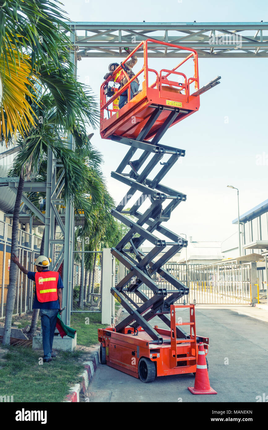 Scissor lift platform and electrical technician operated wiring Stock ...