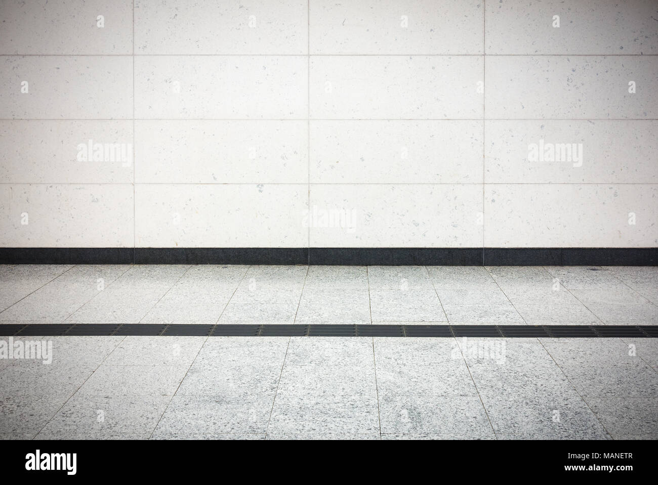 Perspective flooring tile and block wall background Stock Photo - Alamy