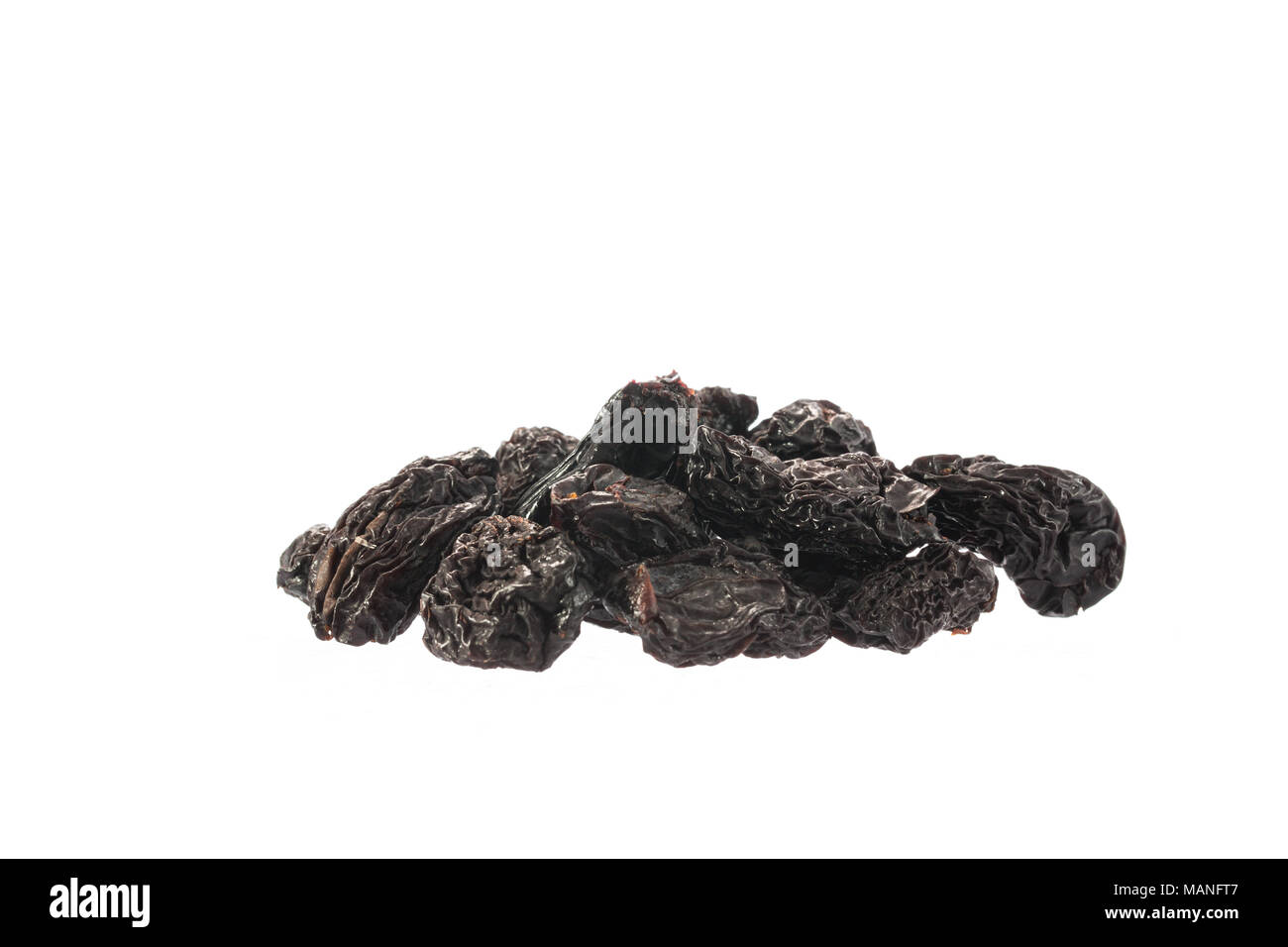 Pile dried black plums Cut Out Stock Images & Pictures - Alamy