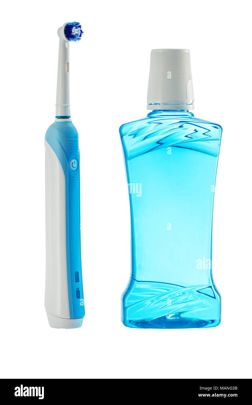 Plastic bottle of mouthwash and electrical toothbrush isolated on white ...