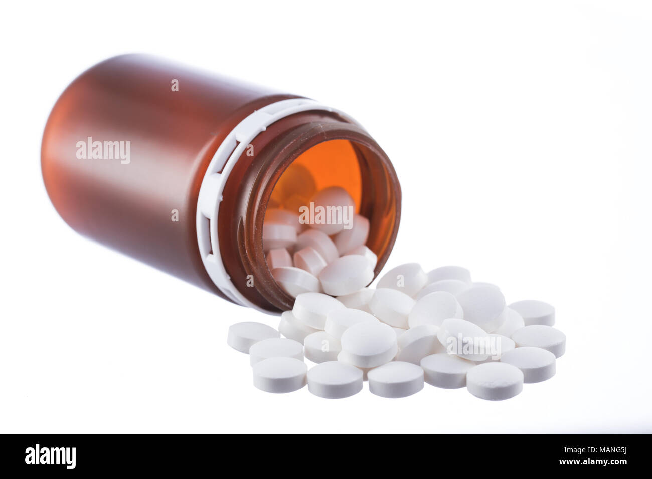 White pills flow from container isolated on white background Stock ...