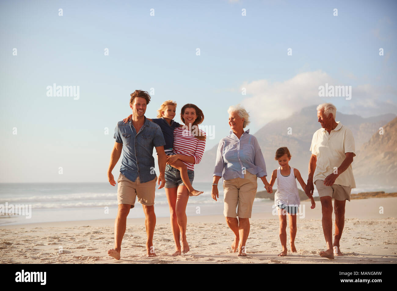 Family beach walking happy hi-res stock photography and images - Alamy