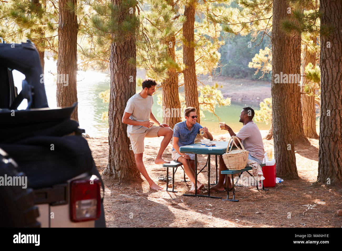 Adults sitting at picnic table hi-res stock photography and images - Alamy