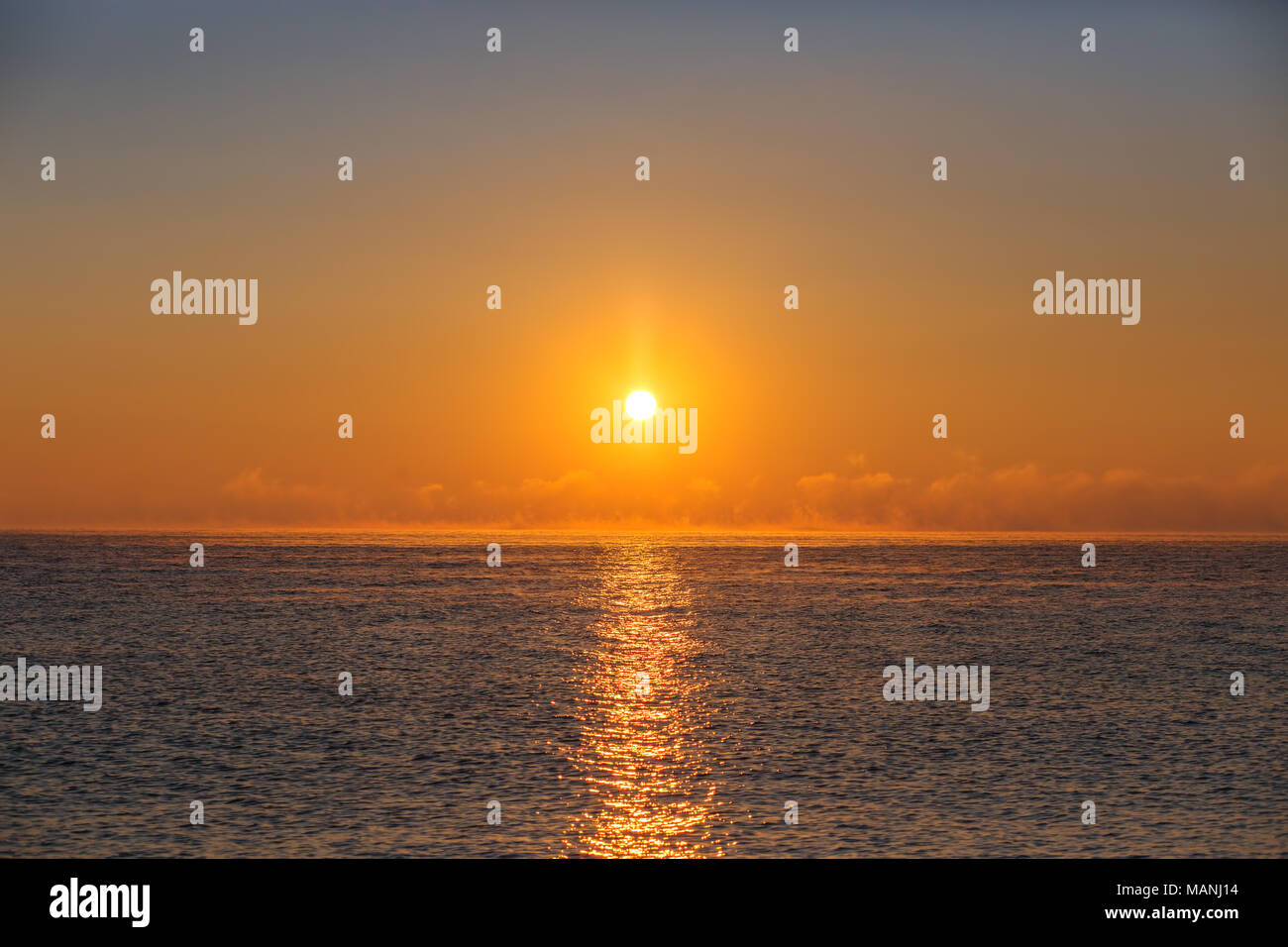 Mist over the sea at sunset hi-res stock photography and images - Alamy