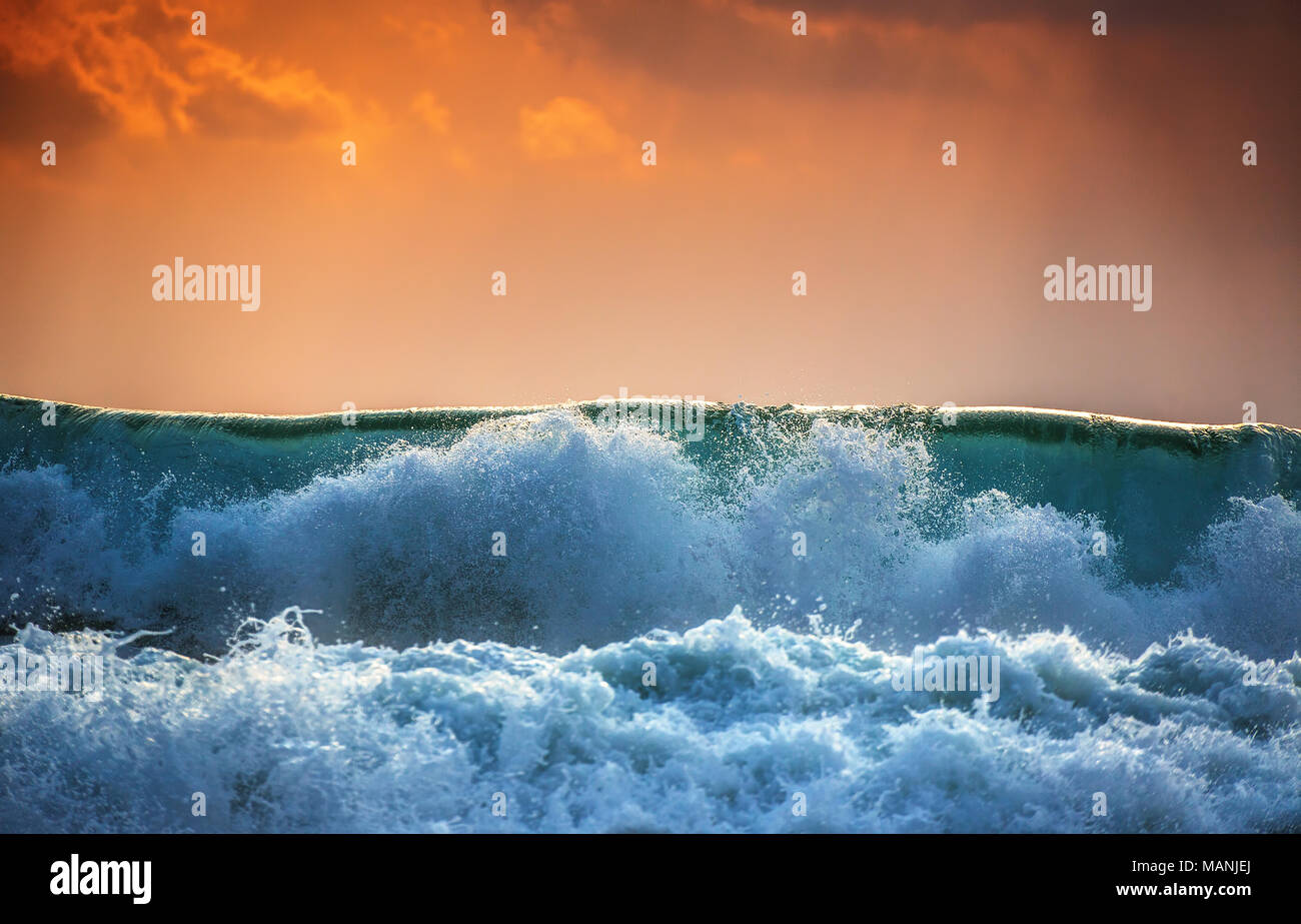 Beautiful green sunrise wave Stock Photo - Alamy