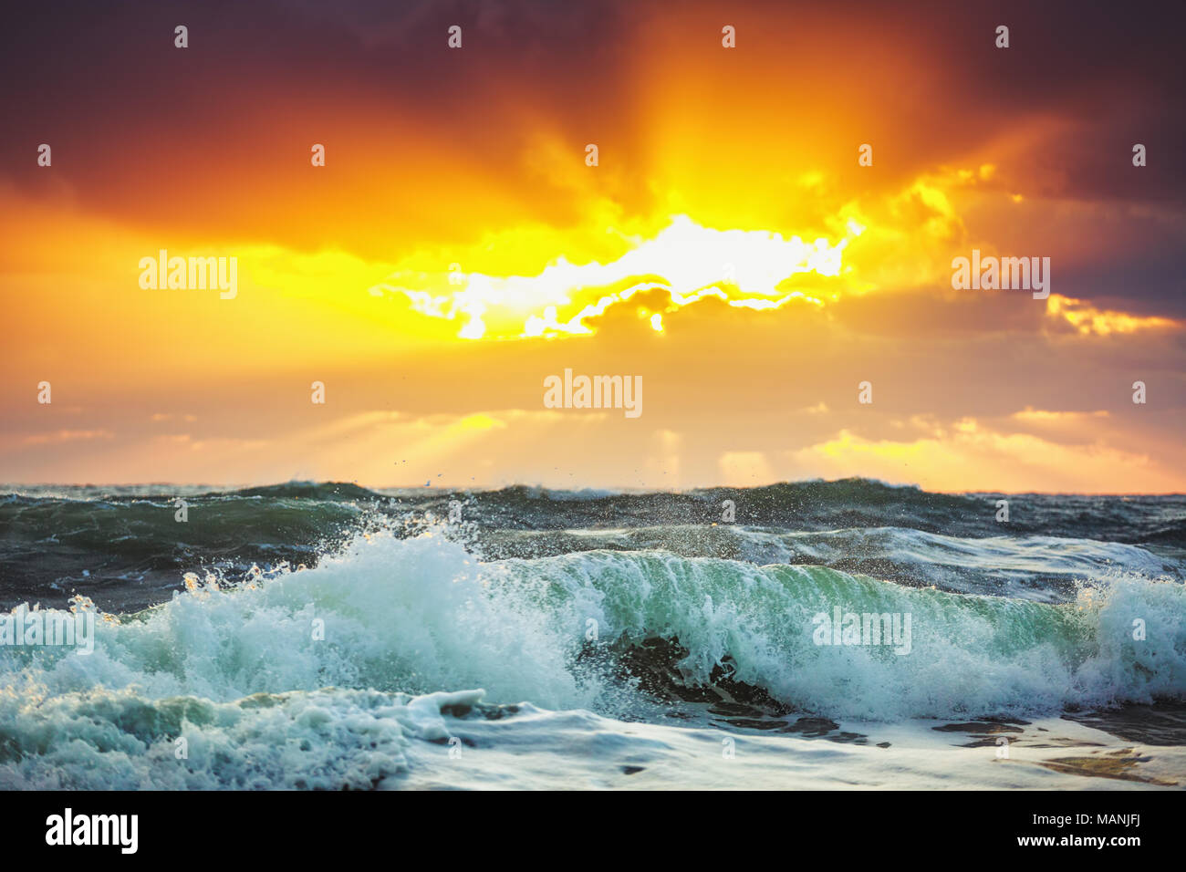 Waves sunrise ocean hi-res stock photography and images - Alamy