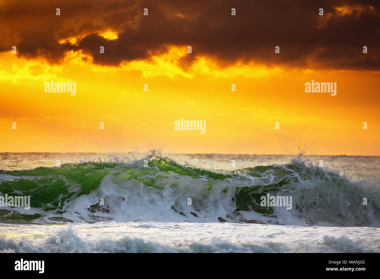 Beautiful green sunrise wave Stock Photo - Alamy