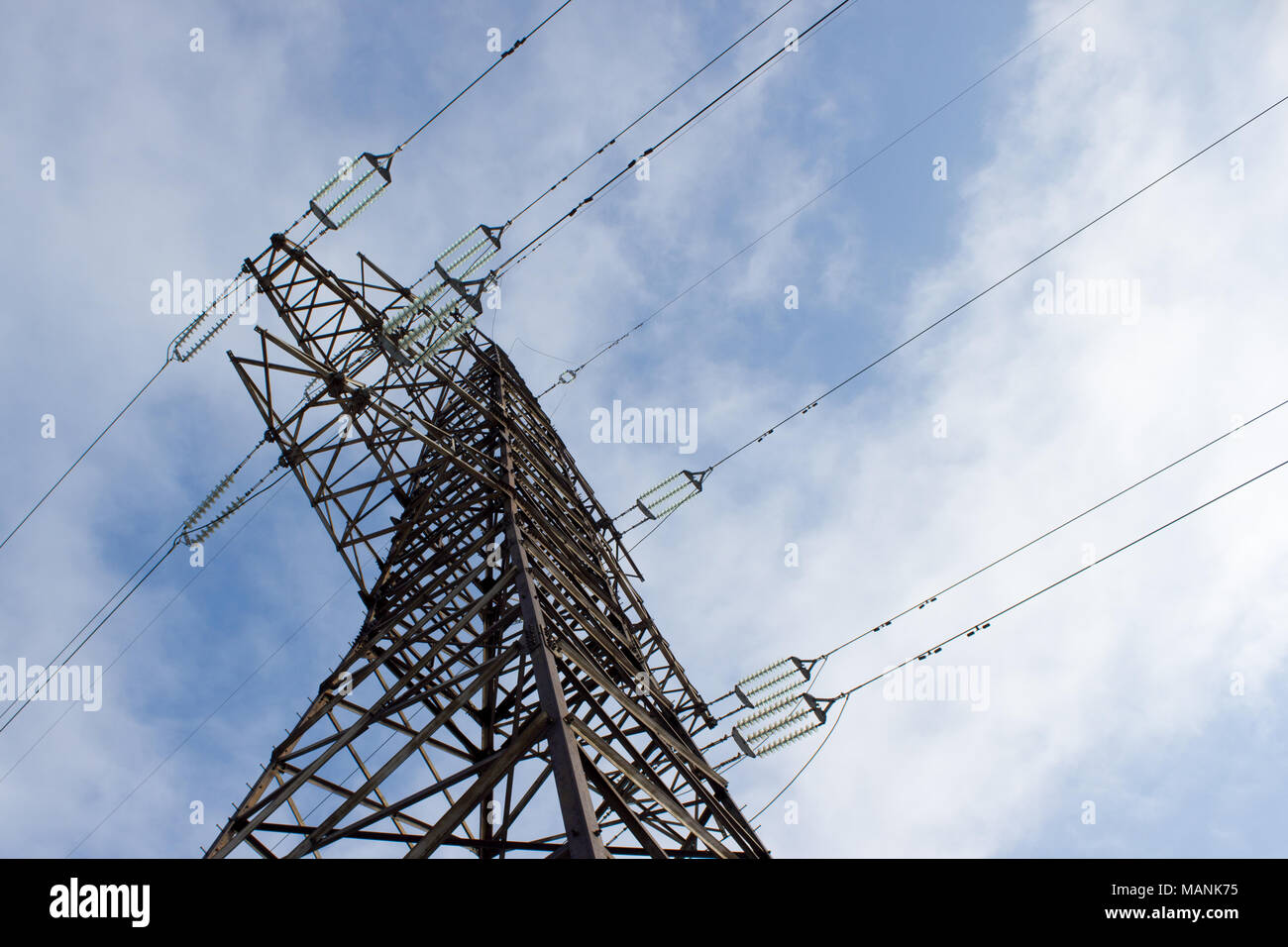 High voltage line on blue sky background Stock Photo - Alamy