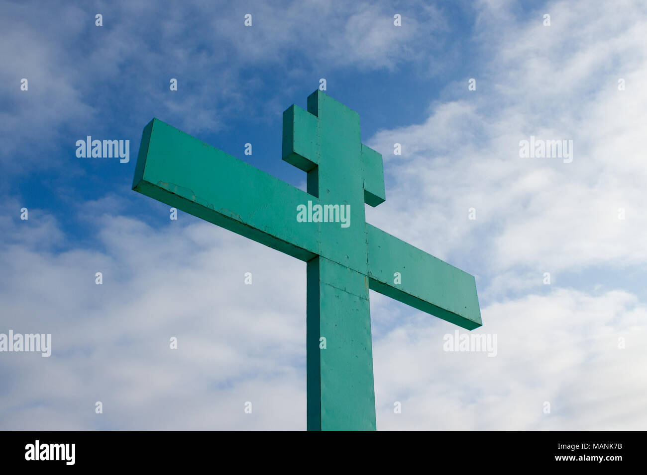 Green Orthodox cross on a background of blue sky Stock Photo - Alamy