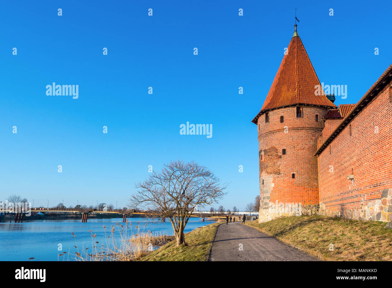 MALBORK, POLAND - April 2, 2017: Riverside promenade and towers of ...