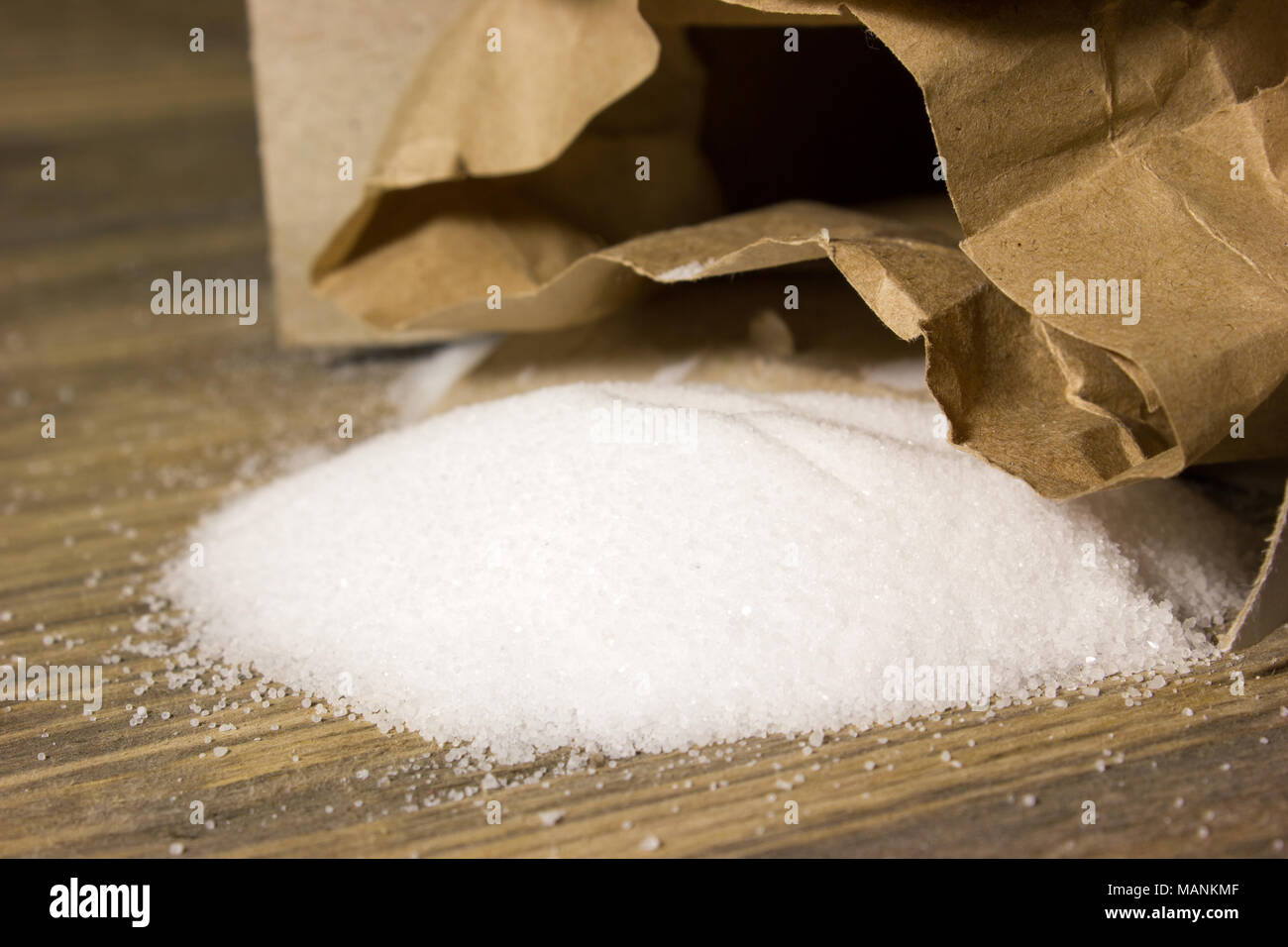 Small table Salt in Kraft box spilled on the wooden background Stock ...