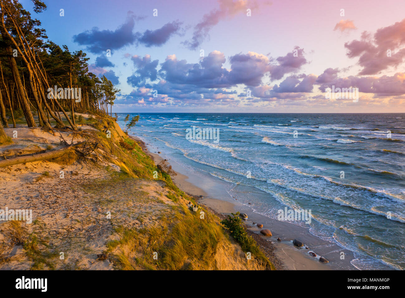 Beautiful sunset on Baltic Sea with colorful cloudy sky, golden sand ...