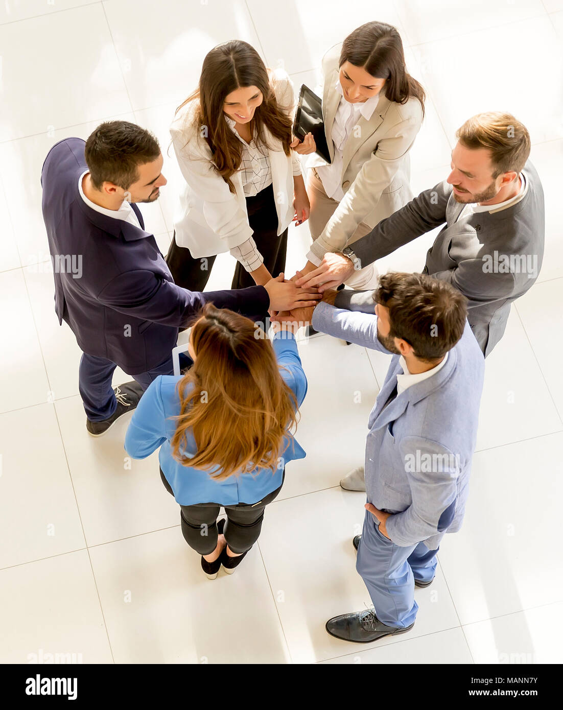 Overhead view of people having business meeting Stock Photo - Alamy