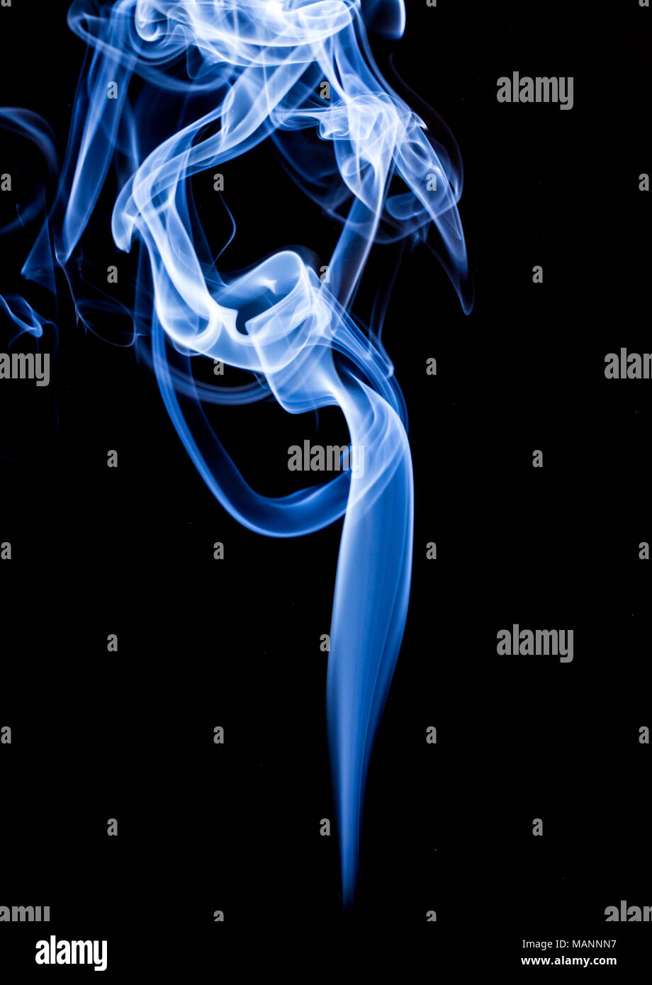 Blue smoke on black background Stock Photo - Alamy