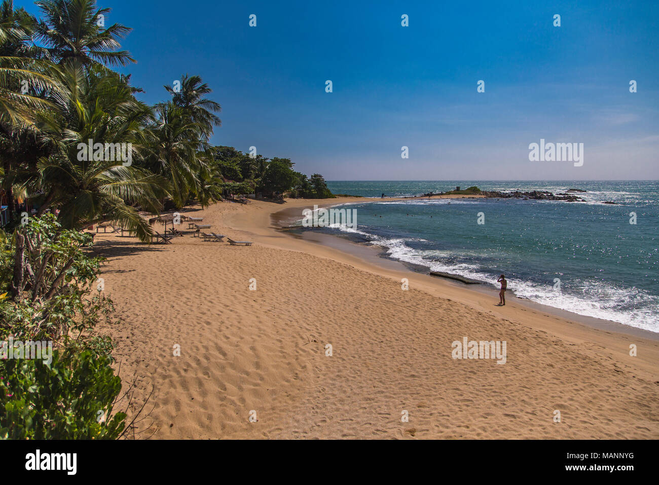 MATARA, SRI LANKA - JANUARY 25, 2014: Unidentified people on beach in ...