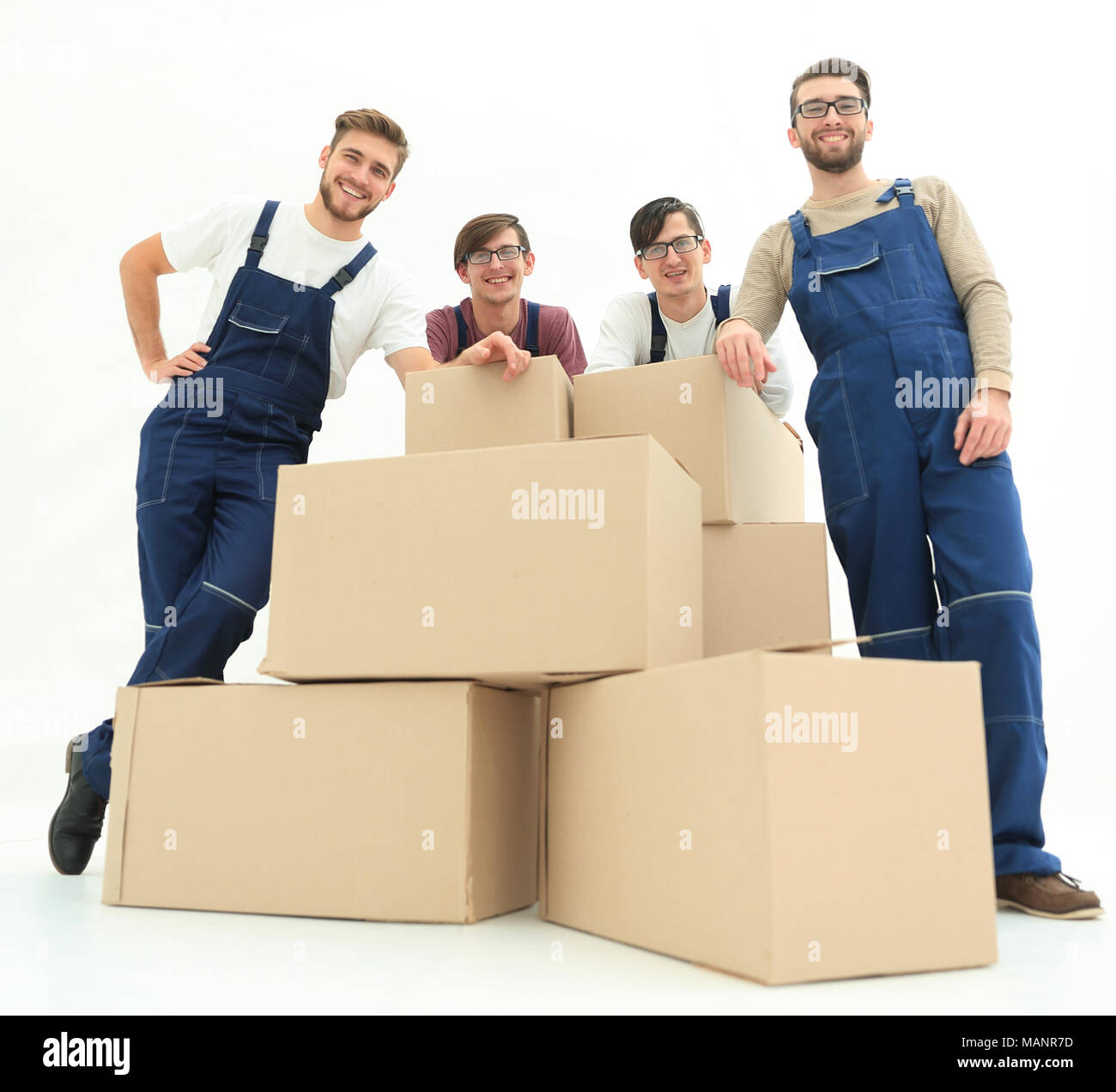 Men with stacked boxes isolated on white Stock Photo - Alamy