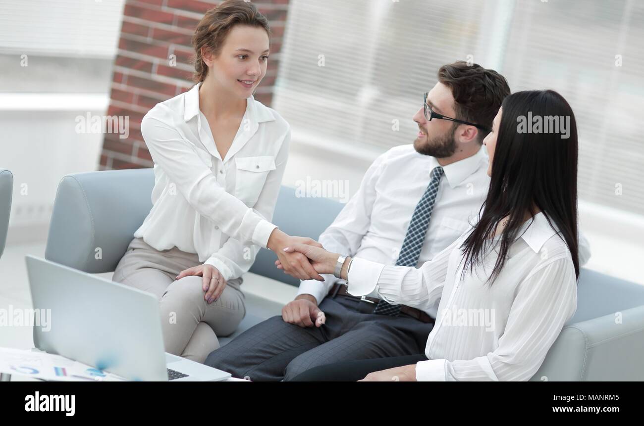 handshake of manager and client in the office lobby Stock Photo - Alamy