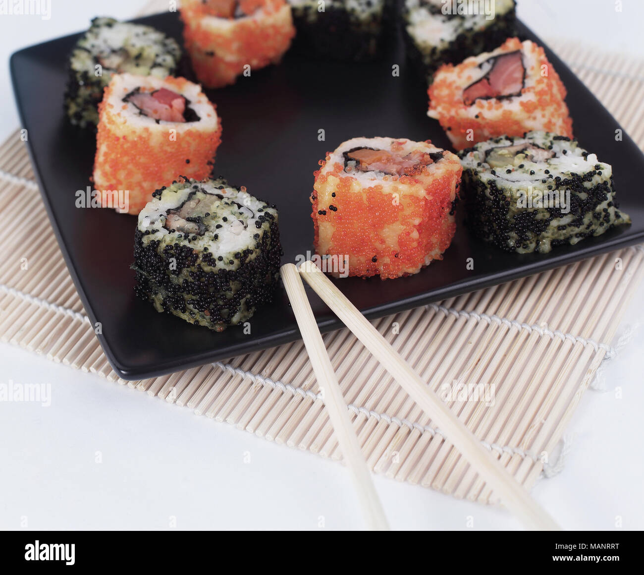 different types of Maki sushi on a black plate Stock Photo - Alamy
