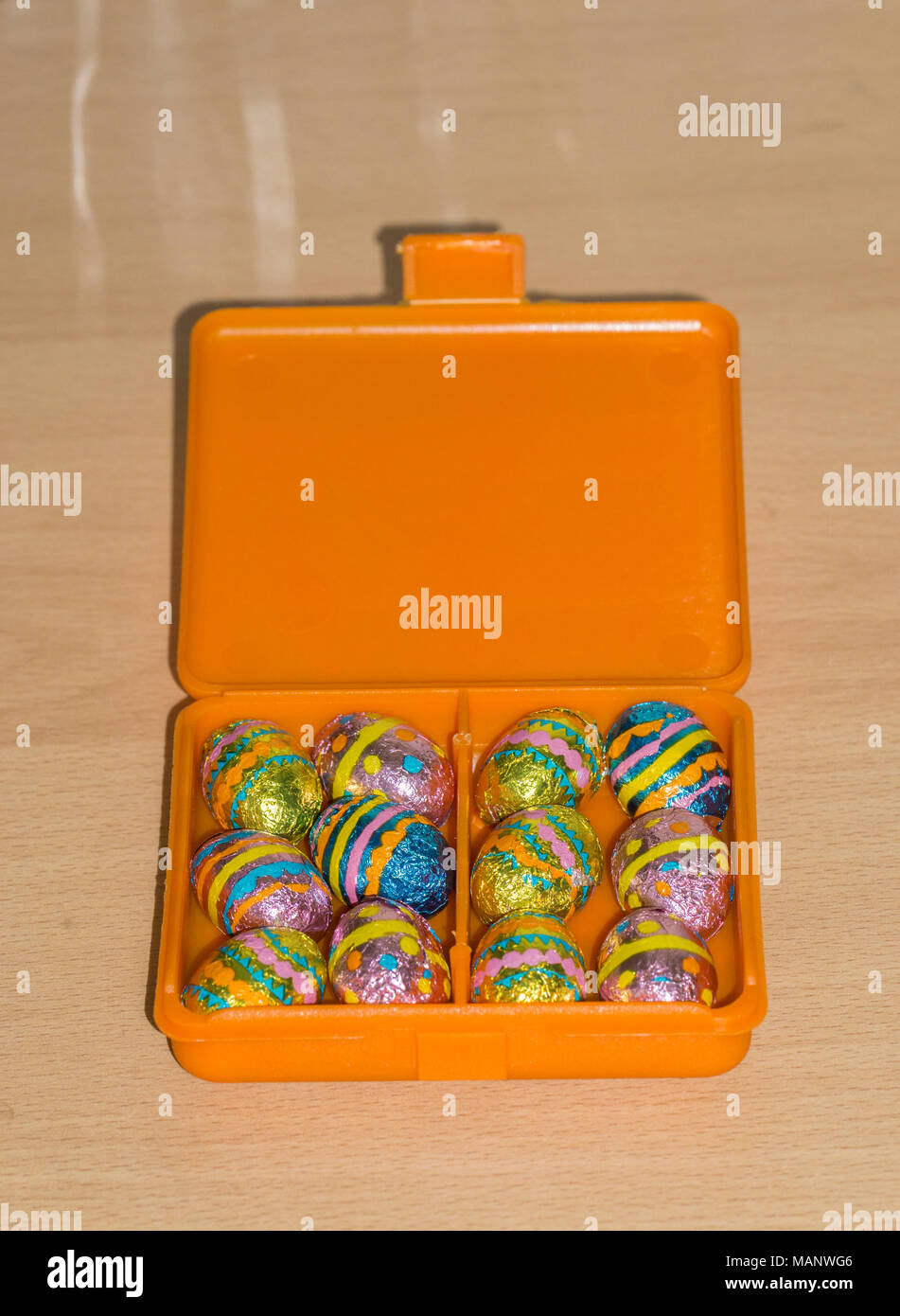 foil wrapped mini chocolate easter eggs in box Stock Photo - Alamy