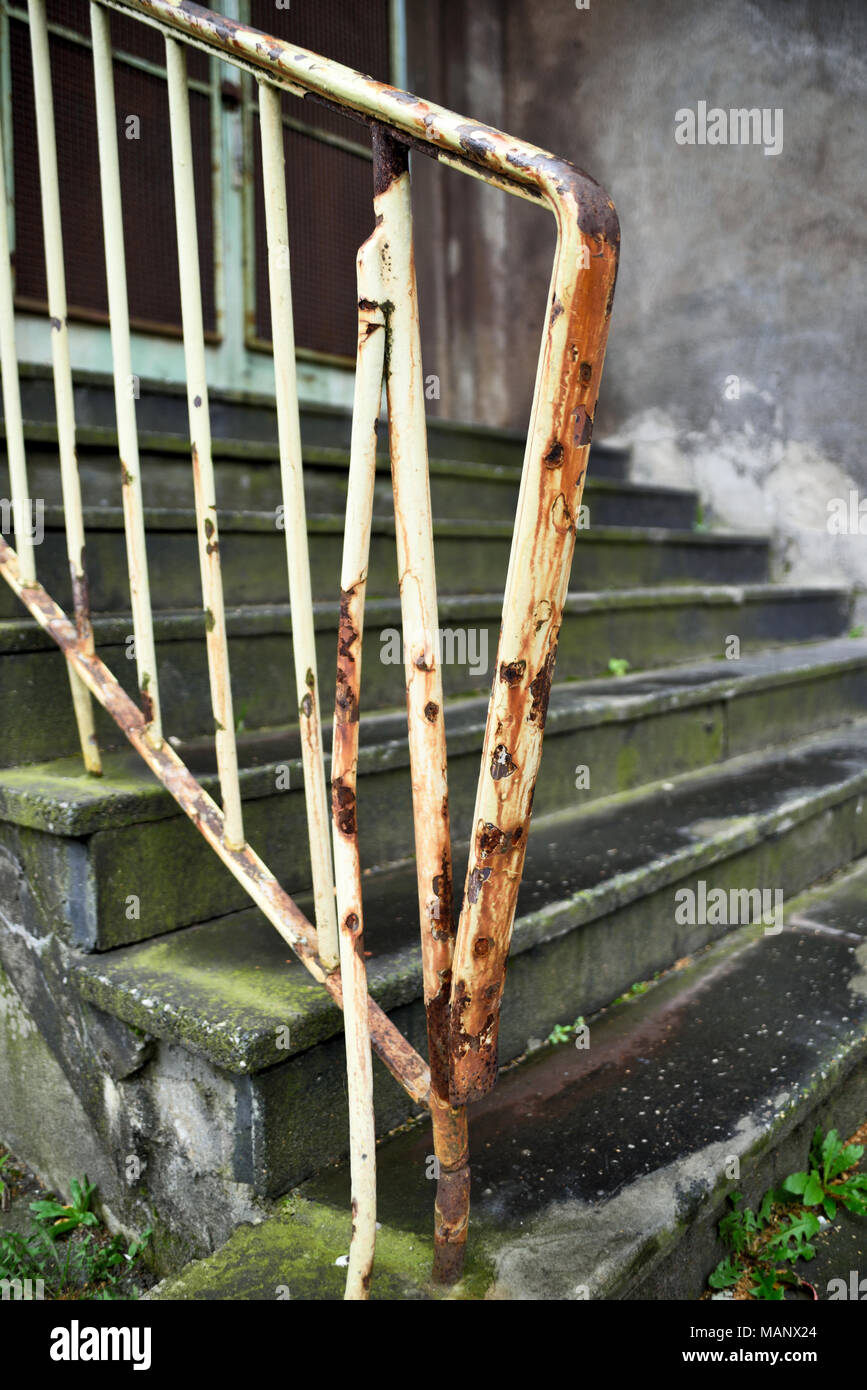 Old house entrance, abandoned house with rusty handrail and weathered ...