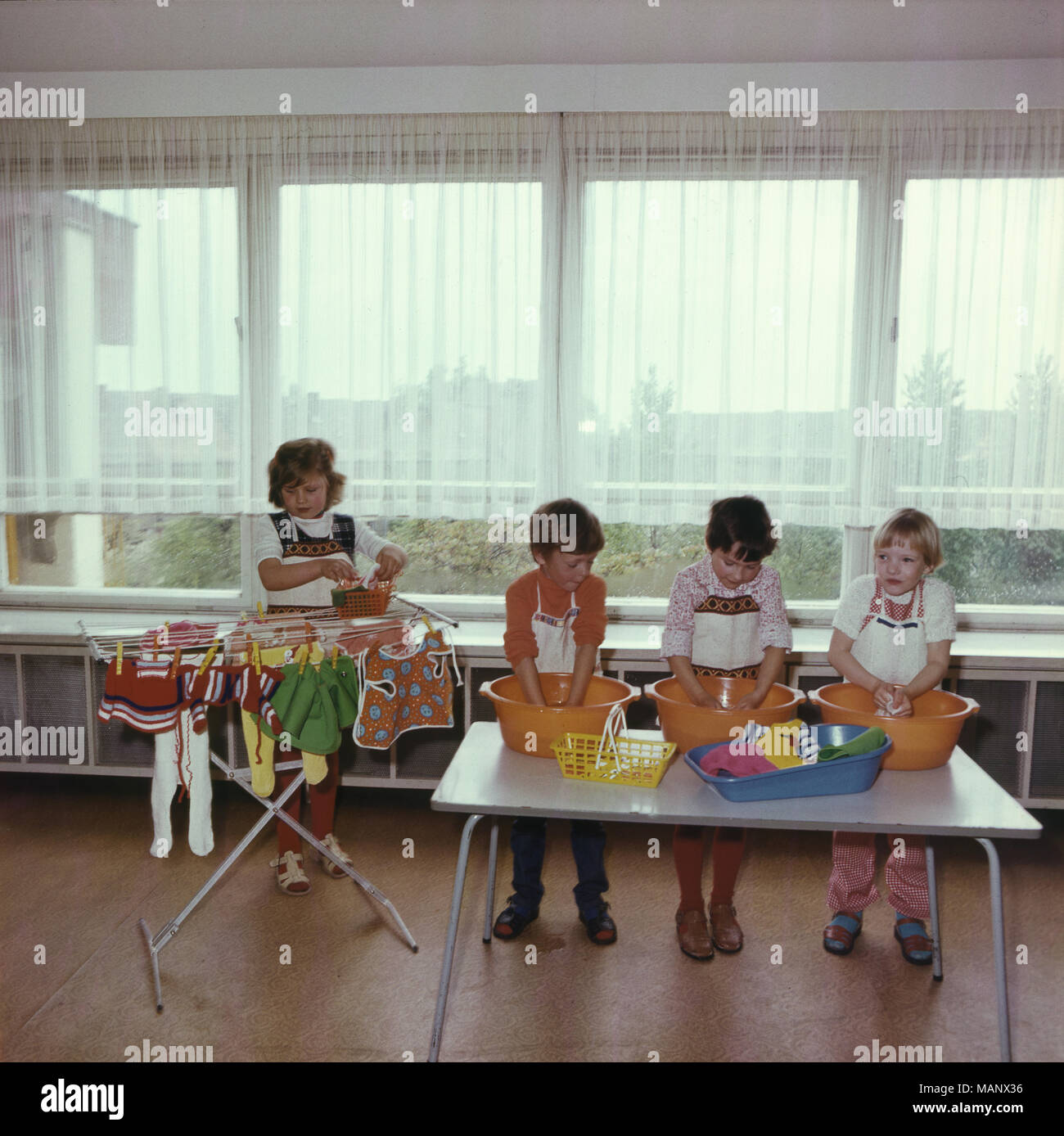 Eisenach, GDR, nursery school children wash clothes by hand Stock Photo ...
