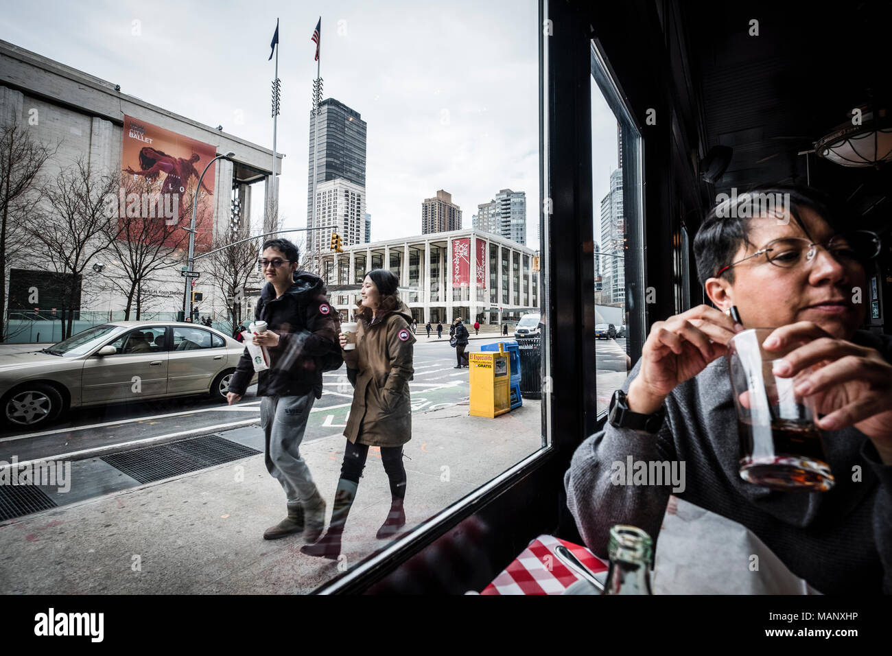 Undefined people wlaking outside of the PJ Clarkes, in front of Loncoln ...