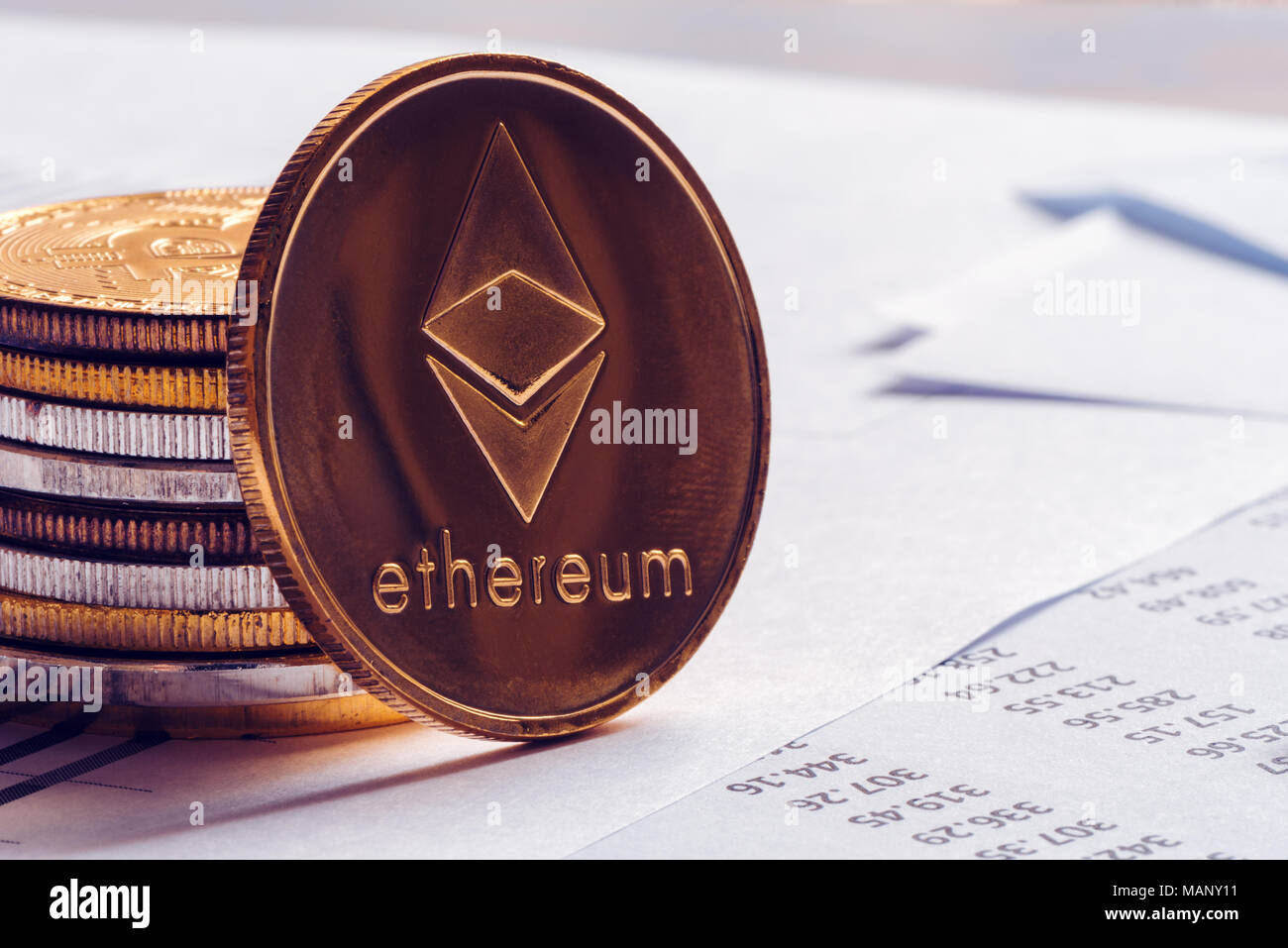 Ethereum cryptocurrency coinage on office desk, selective focus Stock ...