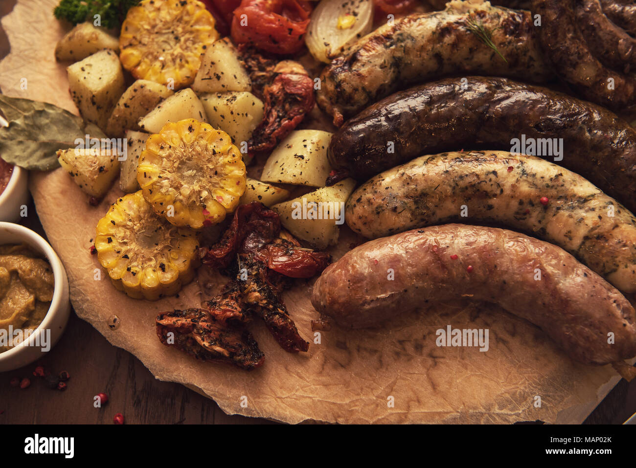 Grilled sausage with vegetables Stock Photo - Alamy