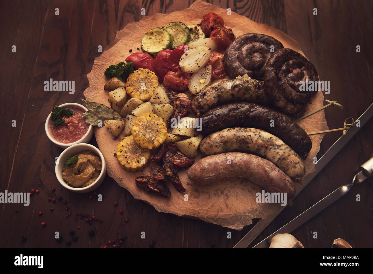 Grilled sausage with vegetables Stock Photo - Alamy