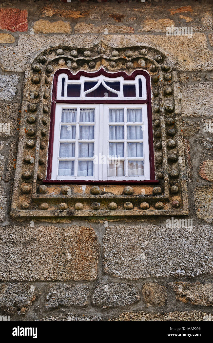 Manueline style window of the medieval village of Linhares da Beira ...
