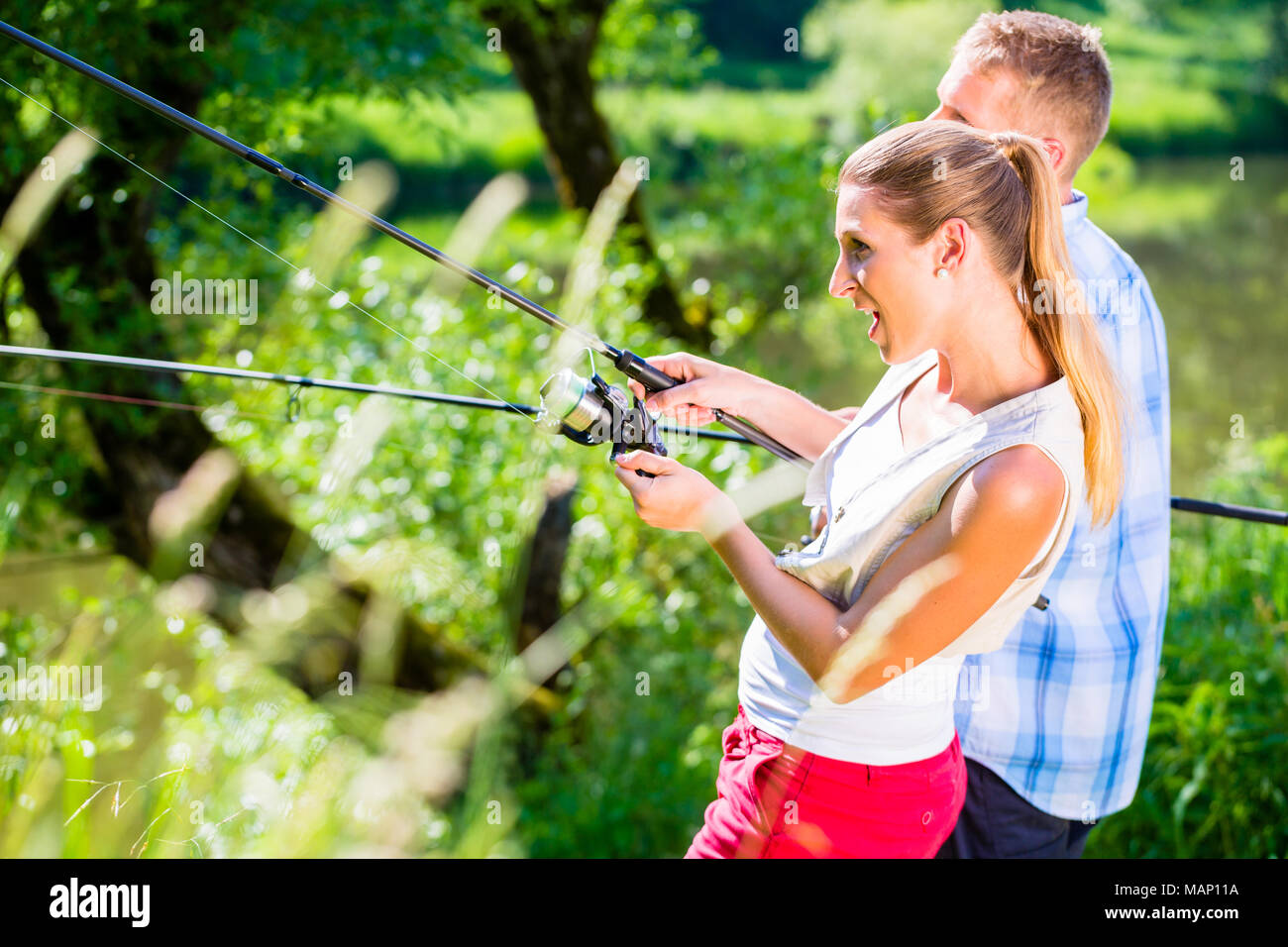 Man woman fishing hi-res stock photography and images - Alamy