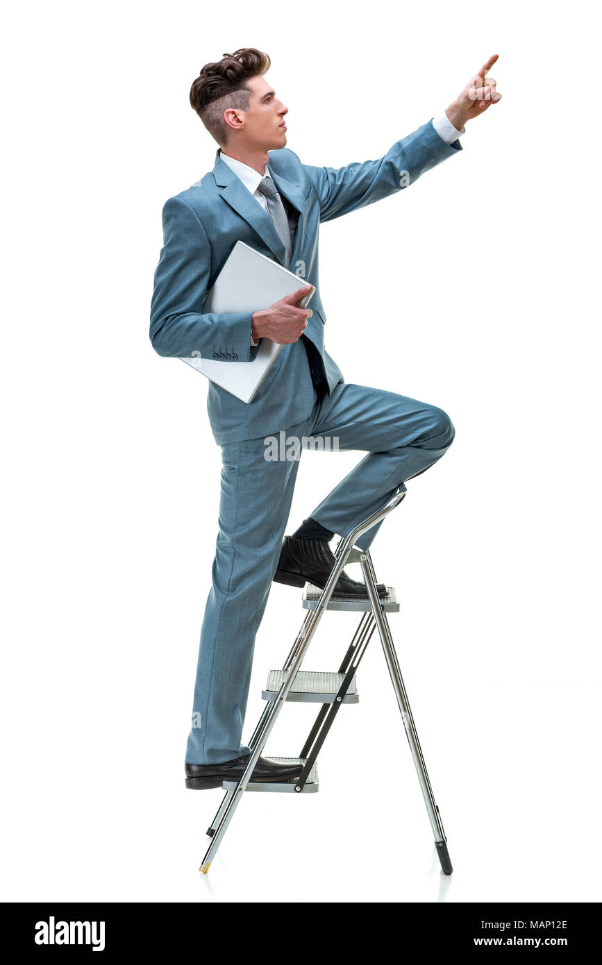 Young handsome businessman climbing up the success ladder looking and ...